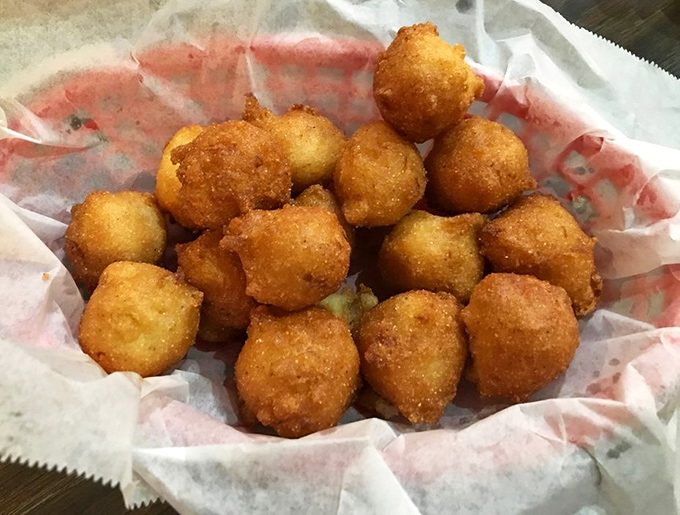 These hushpuppies aren't just side dishes &ndash; they're golden orbs of cornmeal perfection that might upstage the catfish if they weren't so humble about it.