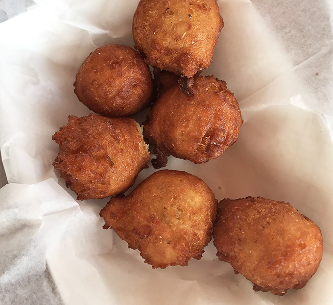 Golden-brown hushpuppies that crunch like a perfect vinyl record drop. These cornmeal treasures are the unsung heroes of any seafood feast.