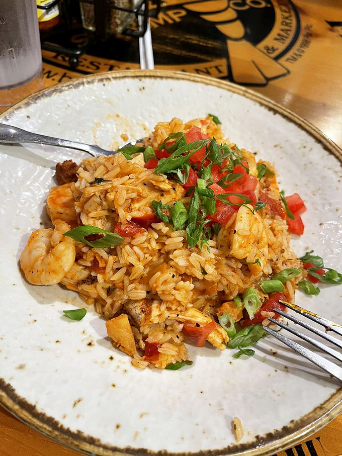 Jambalaya that tells a story with every bite&mdash;spicy rice mingling with shrimp and vegetables, topped with fresh scallions and diced tomatoes.