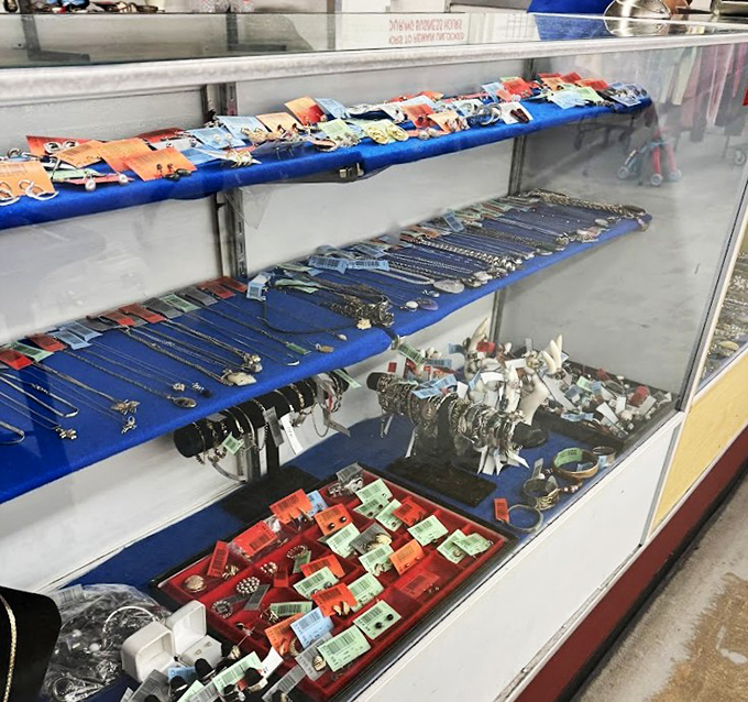 Behind glass lies a glittering universe of accessories&mdash;proof that someone's discarded jewelry box is another's treasure chest of possibilities.