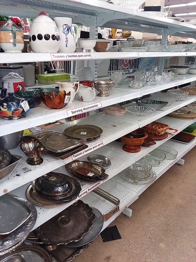 Grandma's kitchen has relocated to these shelves. Vintage serving platters and crystal bowls wait patiently for their next dinner party debut.