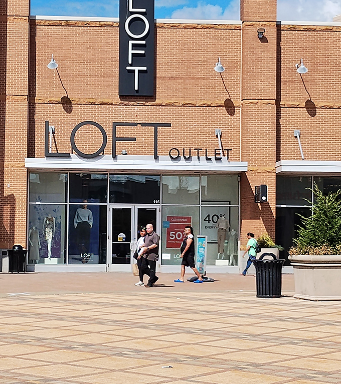 LOFT's brick facade beckons with promises of work-to-weekend versatility. Those 40-50% signs are practically waving you inside.