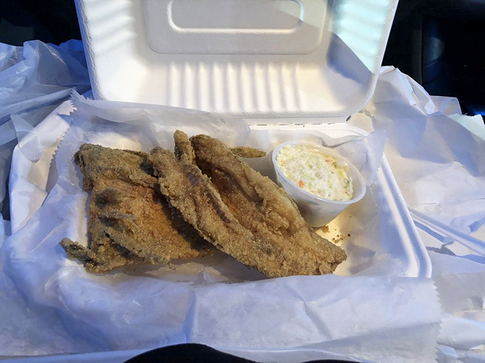 Lake trout served with the kind of cornmeal coating that makes you wonder why anyone bothers with fancy breadcrumbs. Maryland comfort food at its finest.