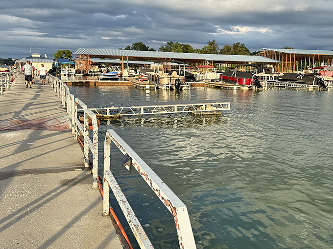 Where boats bob gently against weathered docks, reminding us that the best amenities sometimes come with a little rust and a lot of character.