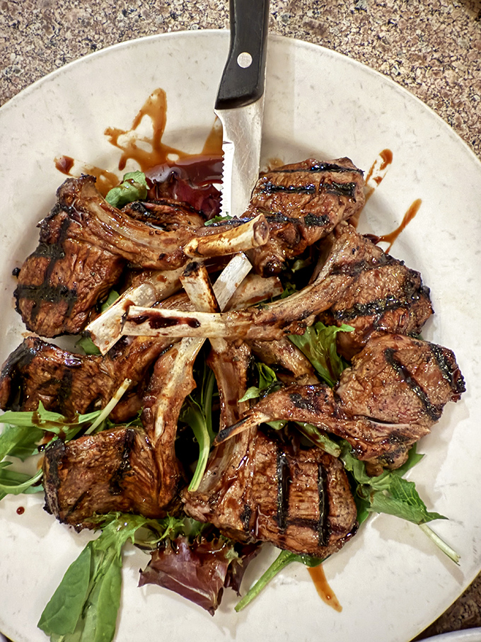 These lamb chops aren't just grilled, they're transformed&mdash;a carnivore's dream resting on a bed of greens like meaty royalty.