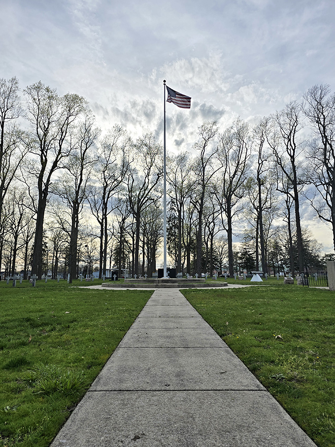 Landis Park's towering trees frame an American flag that seems to stand sentinel over the peaceful green space &ndash; a postcard-perfect slice of Americana.