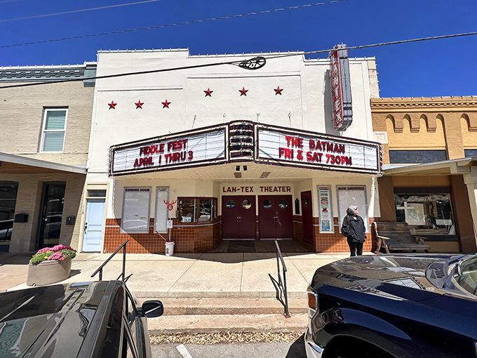 The LanTex Theater's vintage marquee promises the kind of movie night where popcorn tastes better and strangers become neighbors.