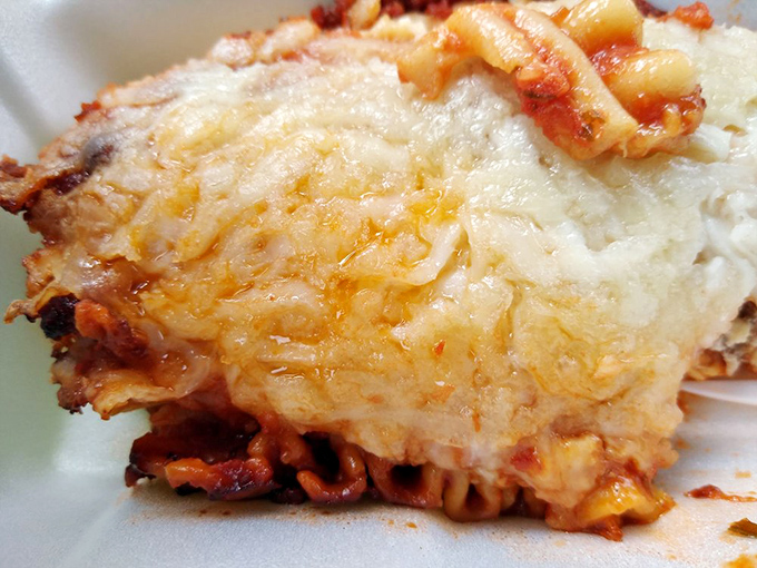 This isn't just lasagna; it's a geological wonder of cheese, pasta, and sauce that would make even Garfield abandon his diet.