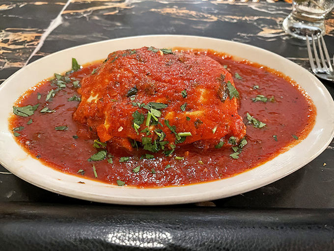 Lasagna that doesn't know the meaning of restraint&mdash;layers of pasta, cheese, and sauce in a pool of marinara magnificence.