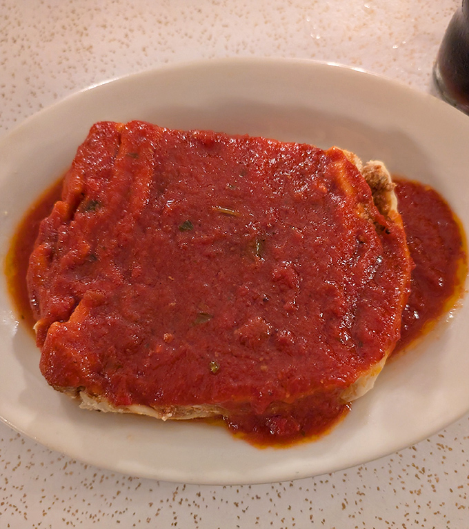 This lasagna isn't just a meal&mdash;it's a warm embrace in food form. The sauce blankets each layer like a cozy Italian sweater on a chilly Cleveland evening.