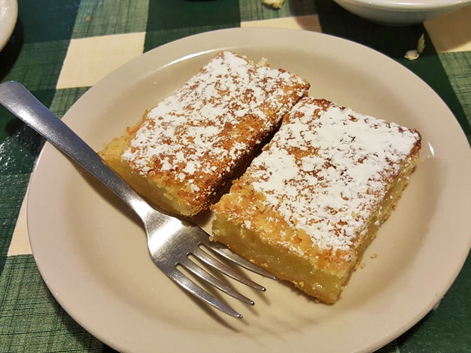 Lemon bars dusted with powdered sugar&mdash;bright, tangy squares of sunshine that provide the perfect sweet counterpoint to a savory deli feast.