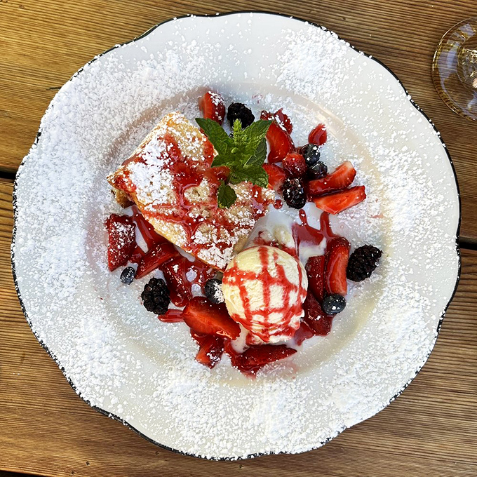 Berry-adorned dessert that doesn't just end the meal&mdash;it celebrates it. That powdered sugar snowfall makes even the strictest diets surrender.