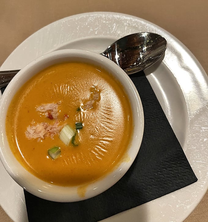 This copper-hued lobster bisque doesn't just warm your stomach&mdash;it hugs your soul with each velvety spoonful of oceanic bliss.