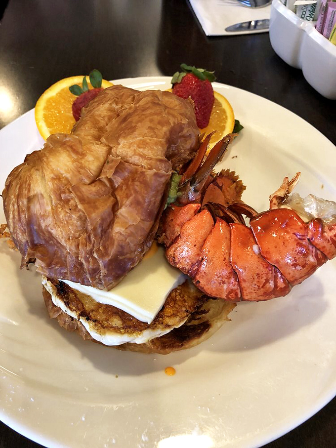 The croissant-lobster-cheese trifecta that makes you wonder why you ever settled for a regular breakfast sandwich all these years.