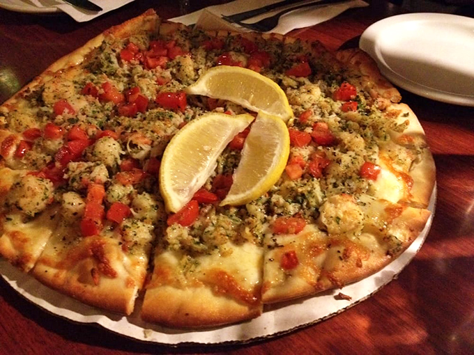 Who said seafood and pizza can't be friends? This lemon-garnished creation proves some of the best relationships are unexpected.
