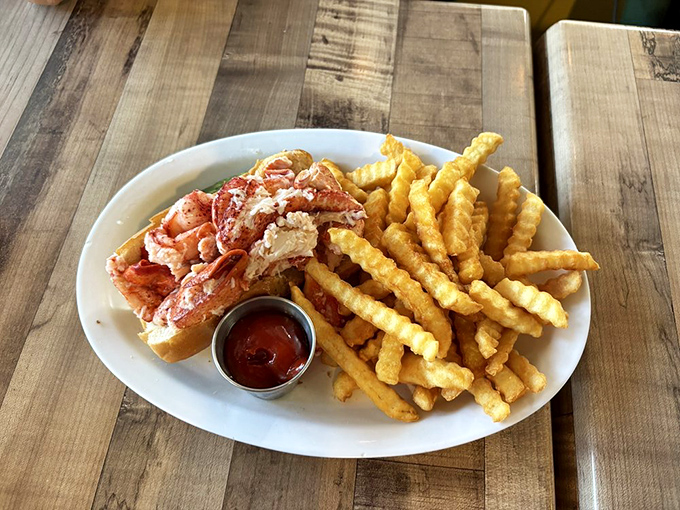 The lobster roll of your dreams &ndash; sweet, succulent meat piled high on a toasted split-top bun with golden fries standing guard. No passport required.