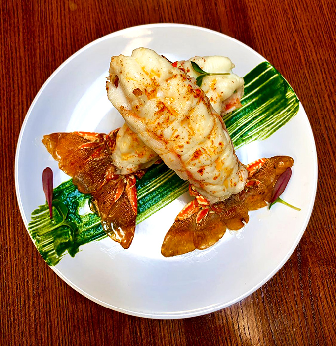Lobster tails so perfectly prepared they deserve their own thank-you note. Served atop vibrant zucchini, this dish is what seafood dreams are made of.