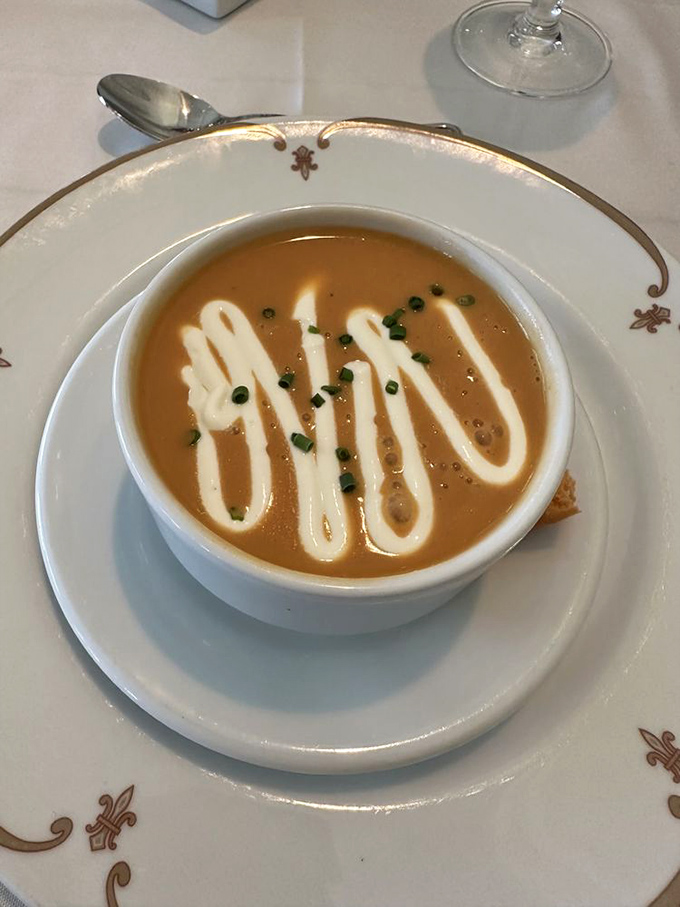 This isn't just soup&mdash;it's lobster bisque elevated to an art form, with a creamy swirl and delicate garnish that makes each spoonful a luxurious experience.