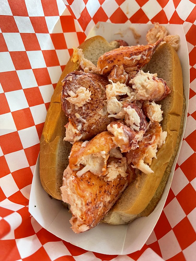 The star of the show—chunks of Maine lobster nestled in a perfectly toasted split-top bun. This isn't just a sandwich; it's a religious experience.