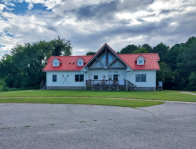 The visitor center stands like a friendly lighthouse of information, its red roof a beacon for curious explorers seeking park wisdom.