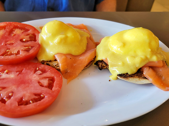 Eggs Benedict gets the deli treatment with silky lox and vibrant tomatoes. Hollandaise sauce cascades down like a yellow waterfall of happiness.