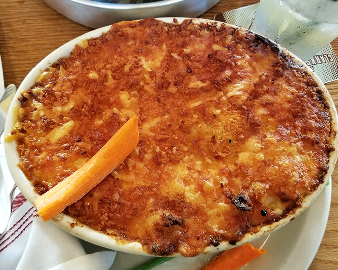 The mac and cheese that launched a thousand food pilgrimages. That golden, bubbling crust is the stained glass window of the pasta world.