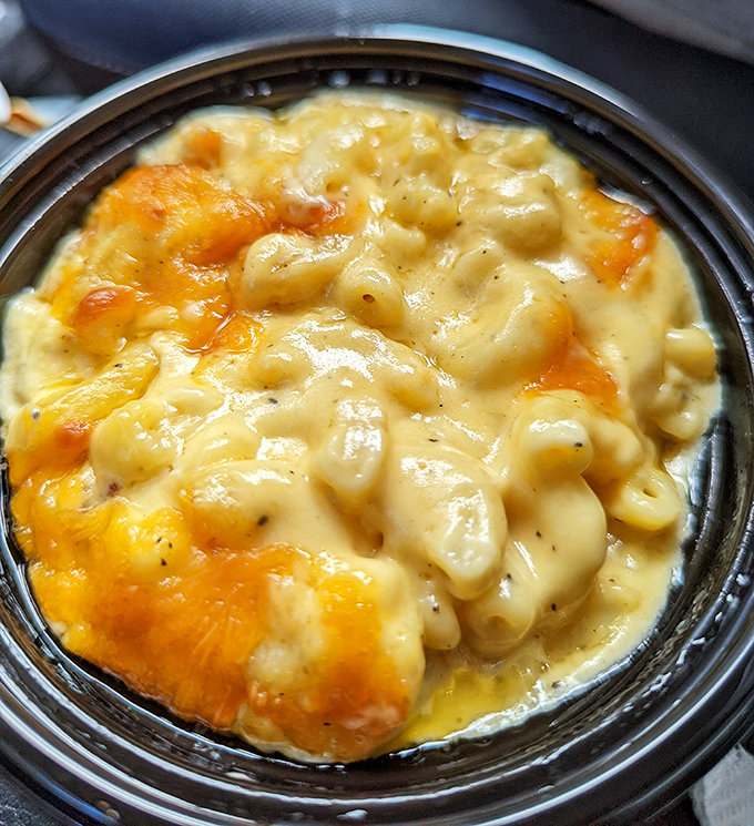 Mac and cheese that doesn't know the meaning of "too cheesy." This creamy masterpiece has the perfect cheese pull that would make any food photographer weep with joy.