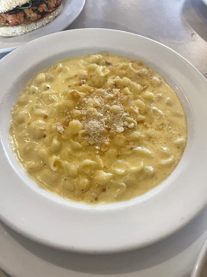 Mac and cheese that doesn't just comfort&mdash;it embraces. The three-cheese blend creates a silky pool of decadence that makes you forget about calorie counting.