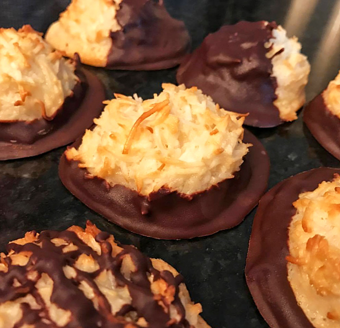 Chocolate-dipped coconut macaroons that would make even the most disciplined nutritionist whisper, "Just one more won't hurt."