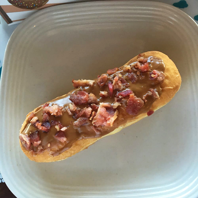 Maple glaze meets crispy bacon on a long john that understands breakfast better than most people do.