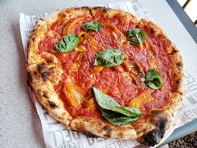 The Margherita pizza&mdash;where simplicity meets perfection. Those charred edges are the pizza equivalent of a perfect sunset.