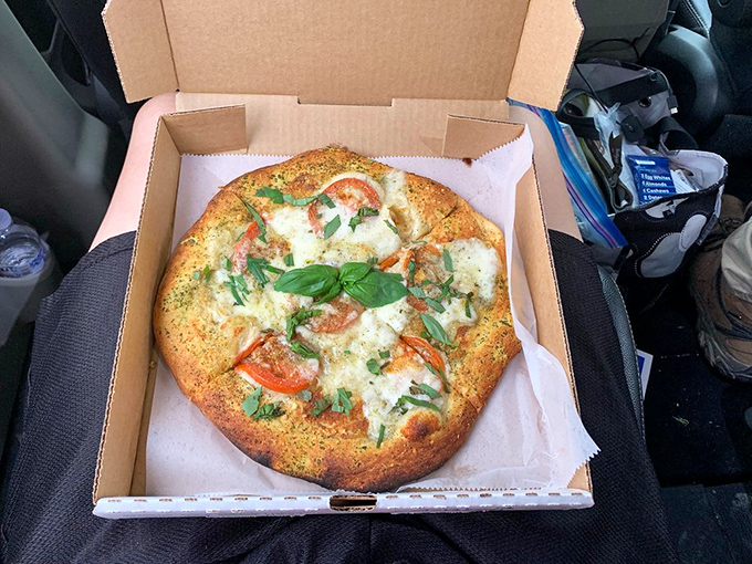 Who knew a BBQ joint could nail pizza too? This wood-fired beauty with fresh basil proves Curt's refuses to be pigeonholed.