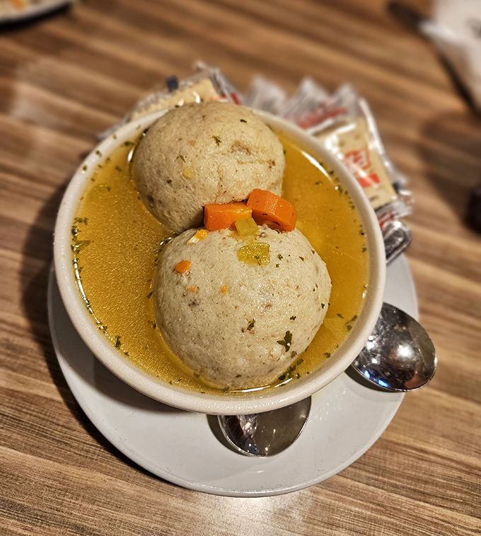 These matzo balls float in golden broth like delicious life rafts for your soul.