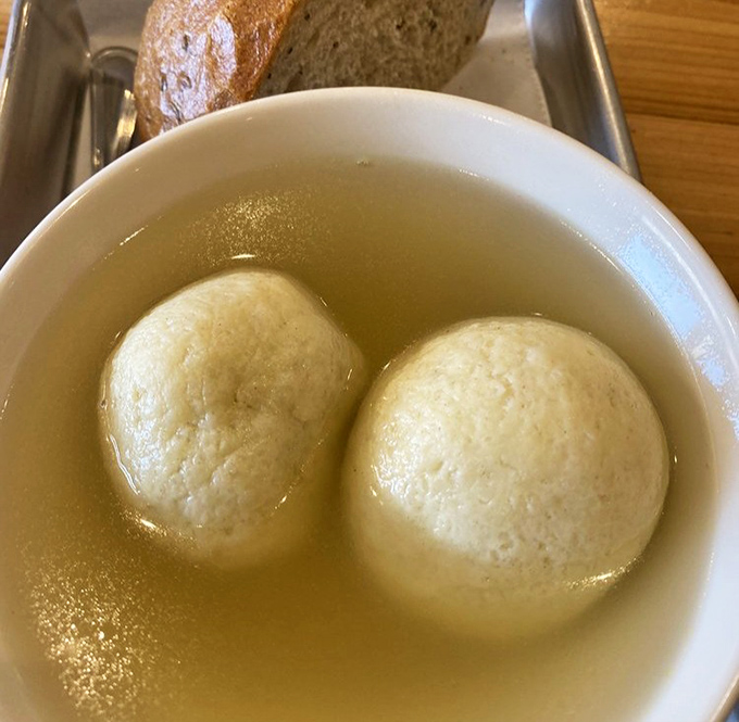 Matzo ball soup that would make your grandmother nod in approval—comfort floating in golden broth, the chicken soup for any soul.