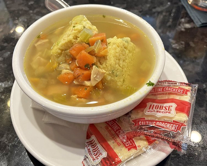 Matzo ball soup that grandmother would approve of&mdash;golden broth, tender vegetables, and a matzo ball that's achieved that perfect cloud-like consistency.