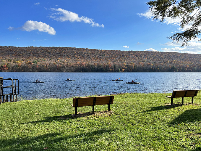 Mauch Chunk Lake serves up tranquility with a side of mountain views, where kayakers glide across water that mirrors the autumn hillsides.