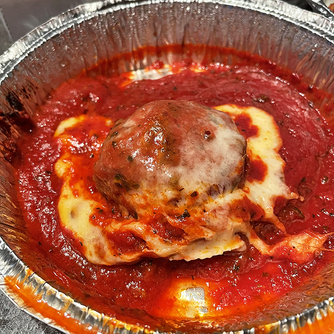 The Sno-Ball meatball: where marinara, melted provolone, and your diet plan have a delicious showdown. Spoiler alert: your diet loses.