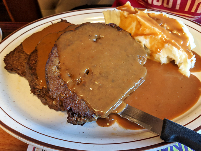 This meatloaf doesn't need a fancy introduction&mdash;just brown gravy cascading down its sides like a savory waterfall meeting mashed potato shores.