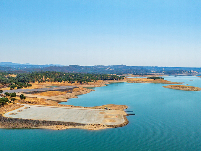 New Melones Lake shimmers like a sapphire amid the golden hills, offering a refreshing escape from California's summer heat.