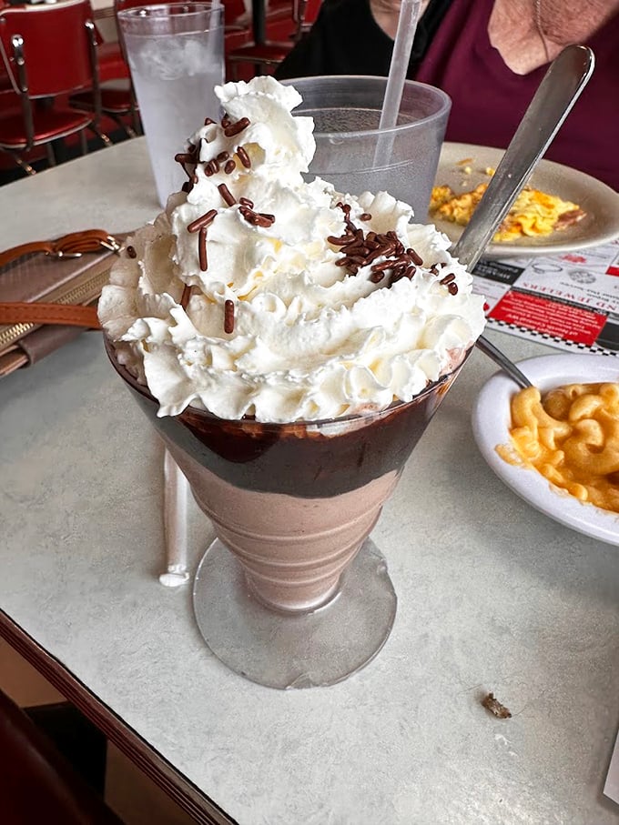This isn't just a milkshake &ndash; it's a tower of chocolate bliss topped with enough whipped cream to make your inner child giggle with delight.