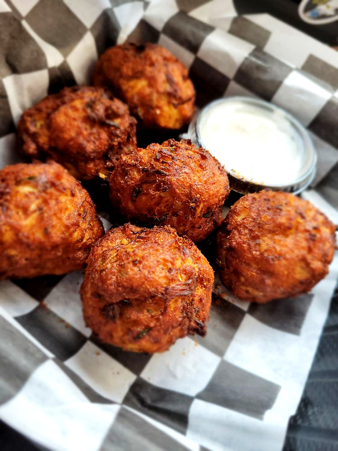 These mini crab cakes aren't just appetizers&mdash;they're Baltimore's culinary ambassadors, crispy on the outside, succulent within, and served with attitude.