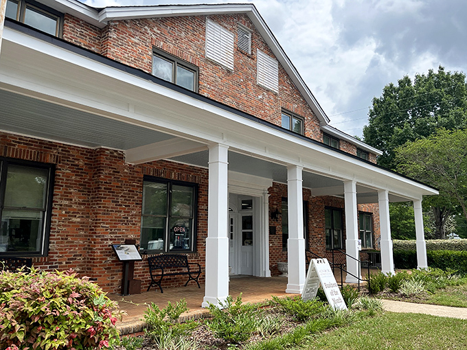 The Monroe County Public Library welcomes readers with a charming brick facade and columned porch&mdash;Harper Lee would surely approve. 
