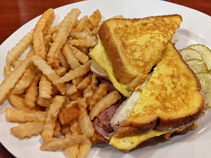 The Monte Cristo: where breakfast and lunch have a delicious identity crisis. Crispy, golden bread embracing ham and cheese—proof that sandwiches can achieve greatness.