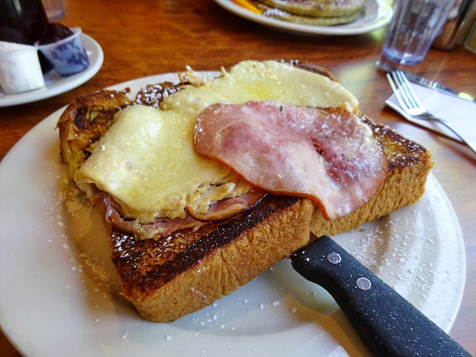 The Monte Cristo: where breakfast and lunch have a delicious identity crisis, complete with melty cheese and ham on perfectly grilled bread.