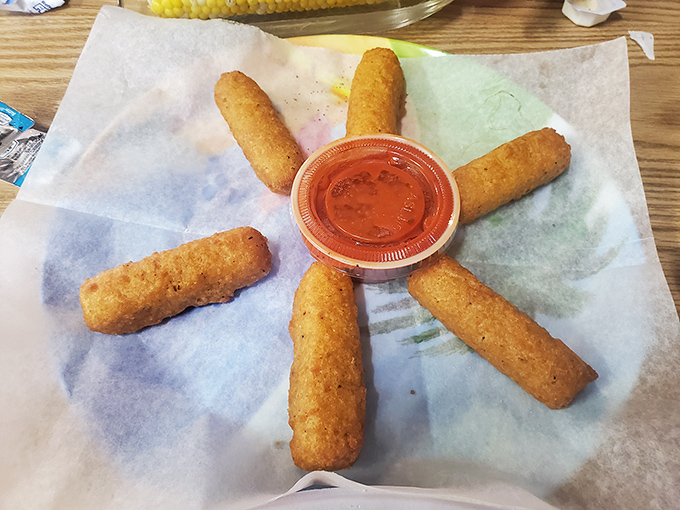 Golden-brown mozzarella sticks arranged like a sunburst around marinara. Comfort food gets the seafood joint treatment&mdash;crispy outside, molten inside.