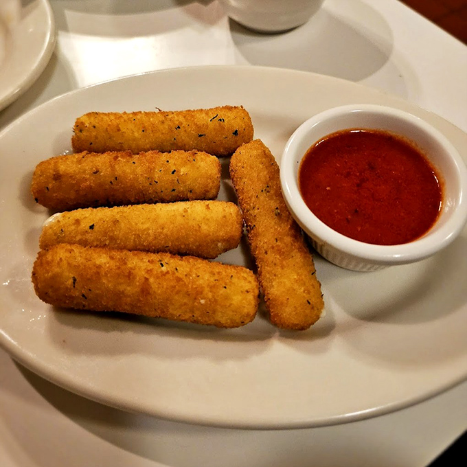 Golden-brown mozzarella sticks that shatter with that first bite, revealing the stretchy cheese inside &ndash; nature's perfect food.