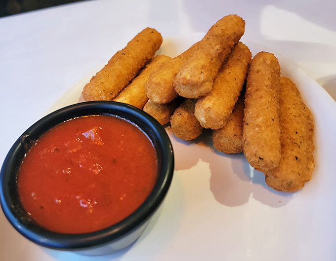 These aren't your average mozzarella sticks—they're the aristocrats of the appetizer world, with a golden-brown exterior guarding that perfect cheese pull.
