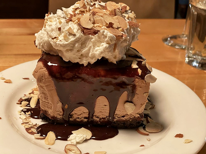 This isn't just dessert&mdash;it's architecture with whipped cream. The chocolate, the almonds, the drizzle&mdash;it's the Taj Mahal of cheesecake.