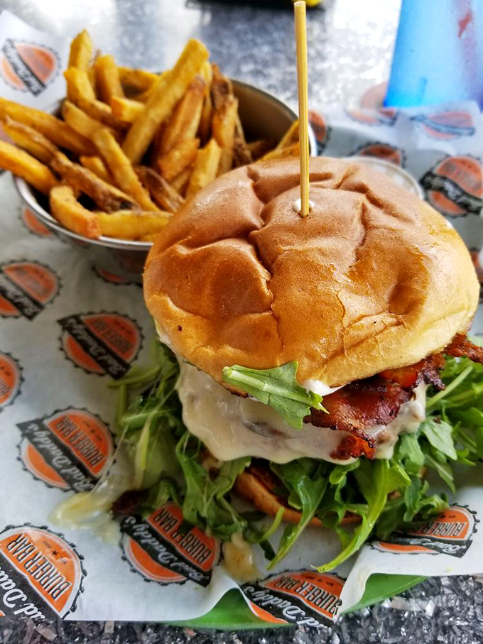 This isn't just a burger&mdash;it's a towering monument to excess, where arugula provides the illusion of healthfulness amid glorious indulgence.