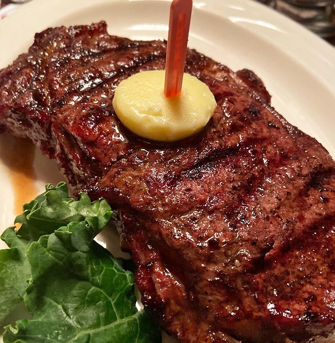 This New York Strip isn't just cooked &ndash; it's been transformed into a carnivore's dream, complete with that signature oak-fired char that whispers sweet nothings to your taste buds.